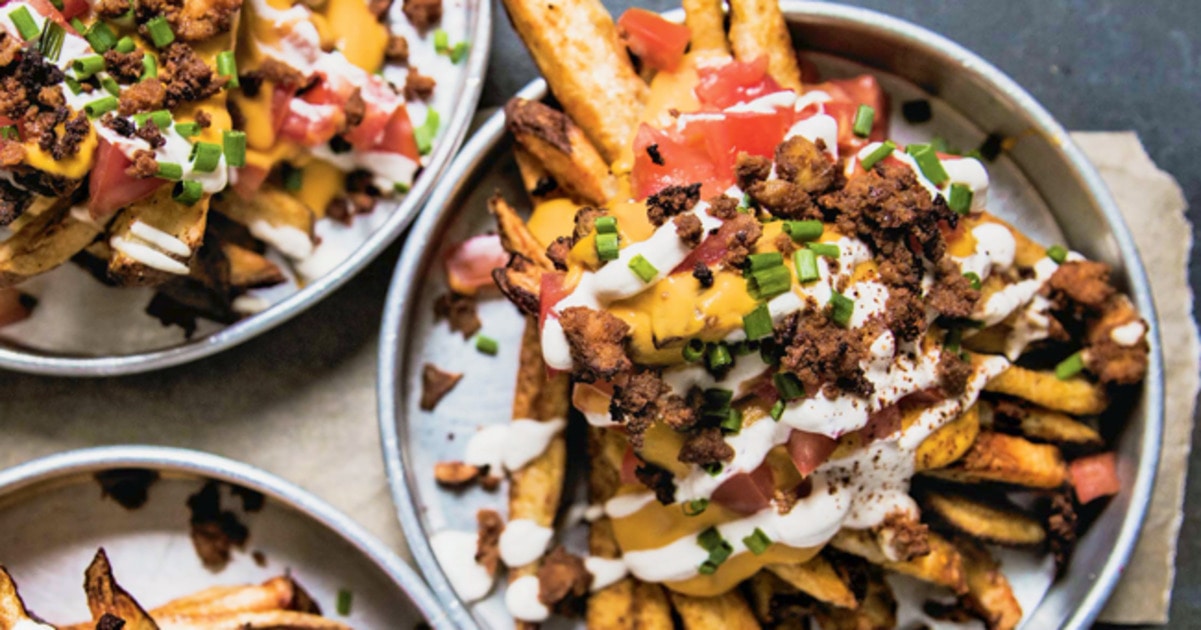 Supreme Vegan Nacho Fries With Tofu Bacon Crumbles | VegNews