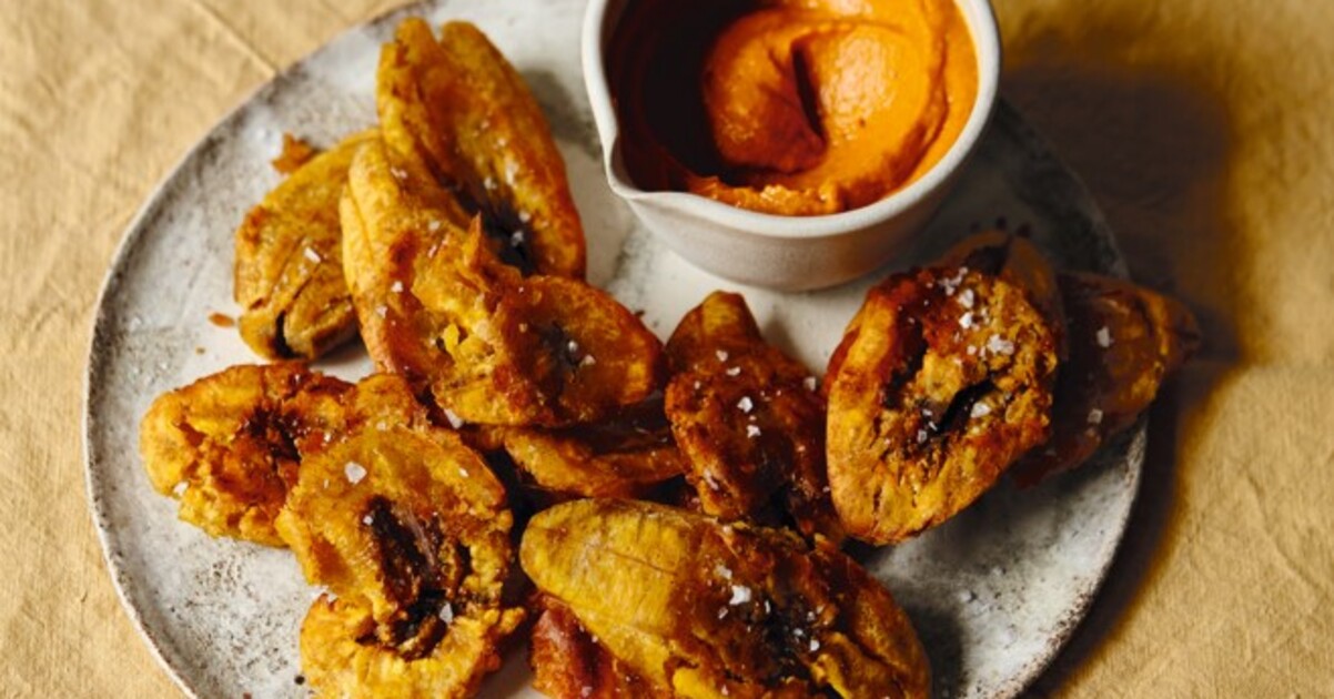 Loaded Tostones With Spicy Roasted Carrot Dip | VegNews